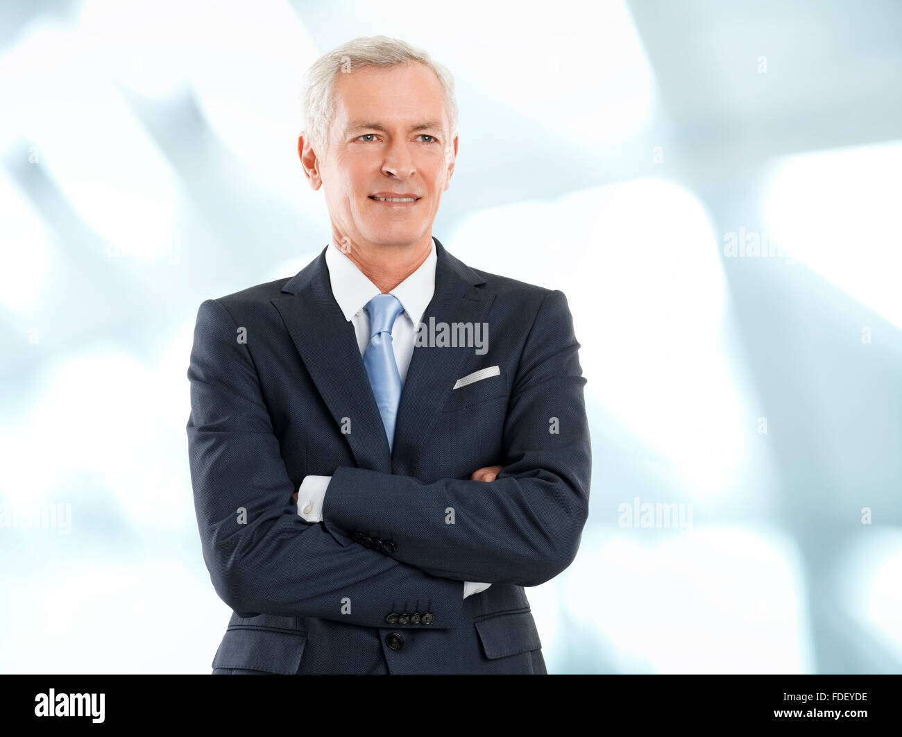 Portrait of senior broker standing at office Stock Photo - Alamy