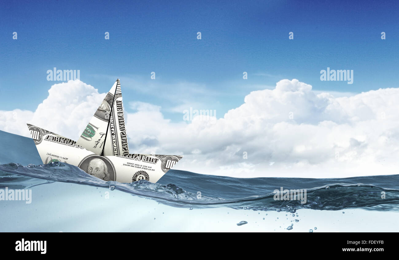Ship made of dollar banknote floating in water Stock Photo - Alamy