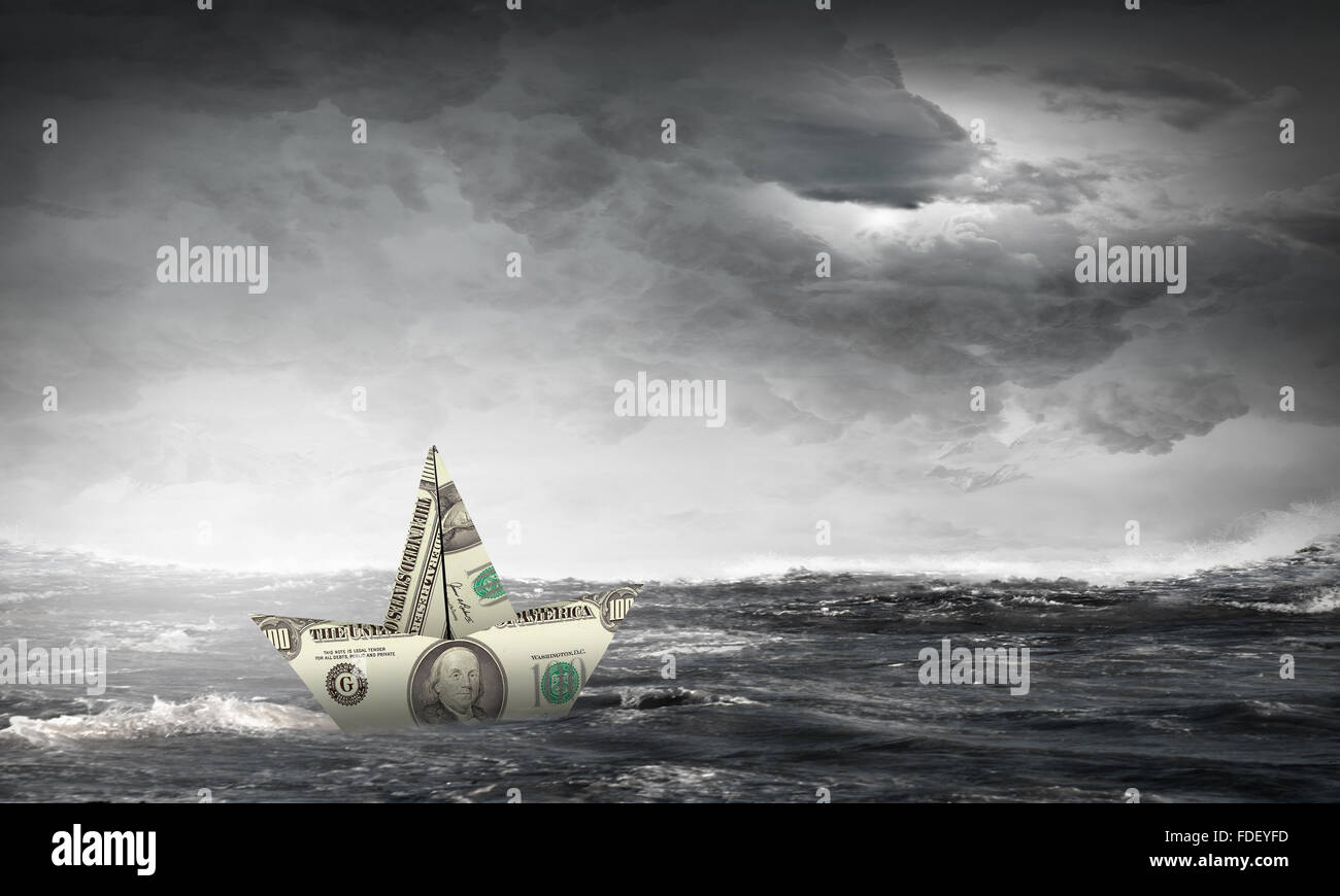 Ship made of dollar banknote floating in water Stock Photo - Alamy