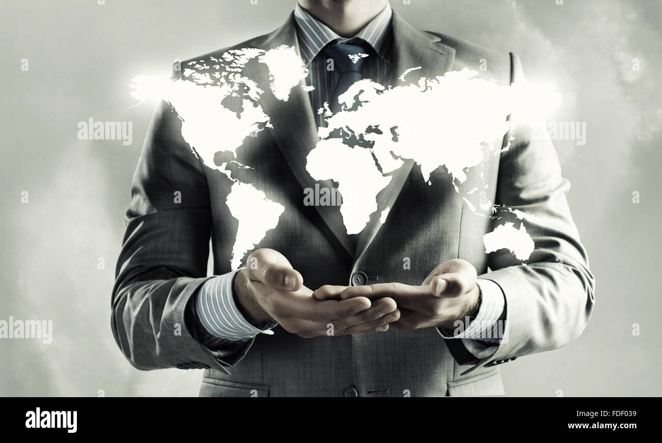 Close up of businessman holding world map in hands Stock Photo - Alamy