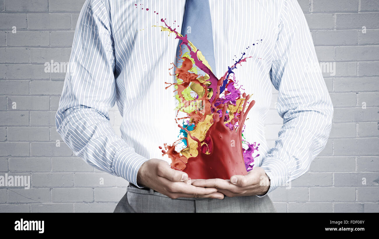 Close up of businessman with paint splashes in hands Stock Photo - Alamy