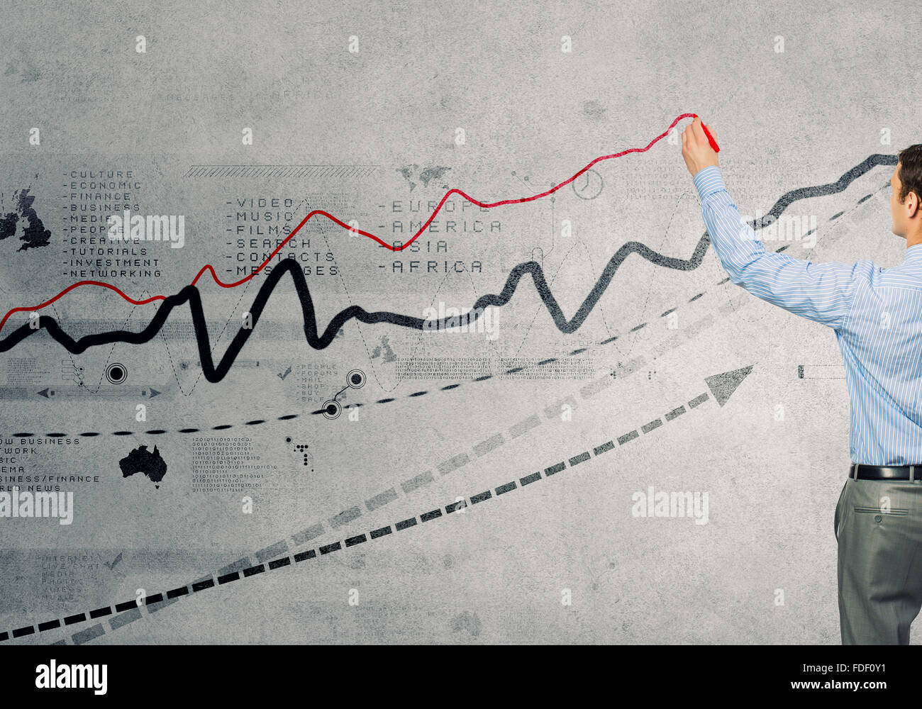 Back view of businessman drawing graphs on wall Stock Photo - Alamy