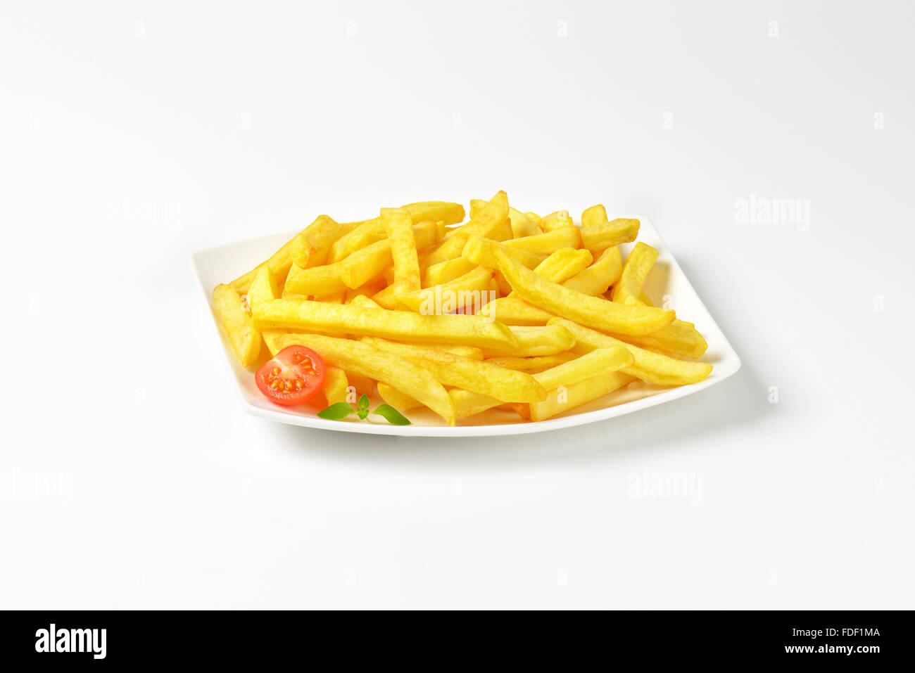 plate of french fries on white background Stock Photo - Alamy