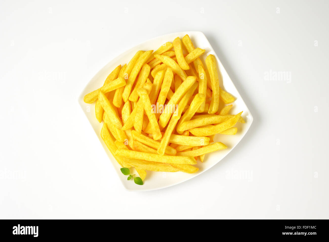 plate of french fries on white background Stock Photo - Alamy