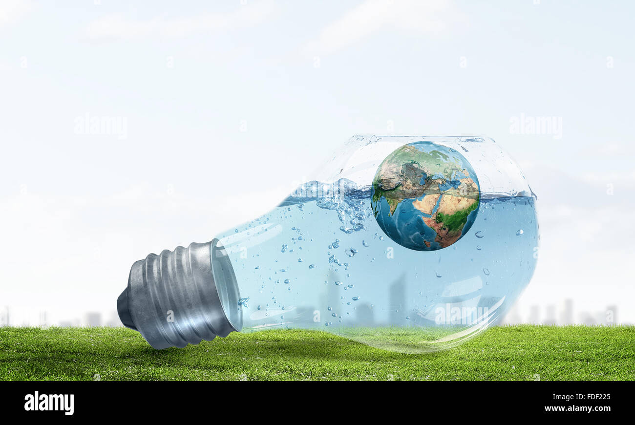 Glass light bulb filled with water and floating Earth planet. Elements ...