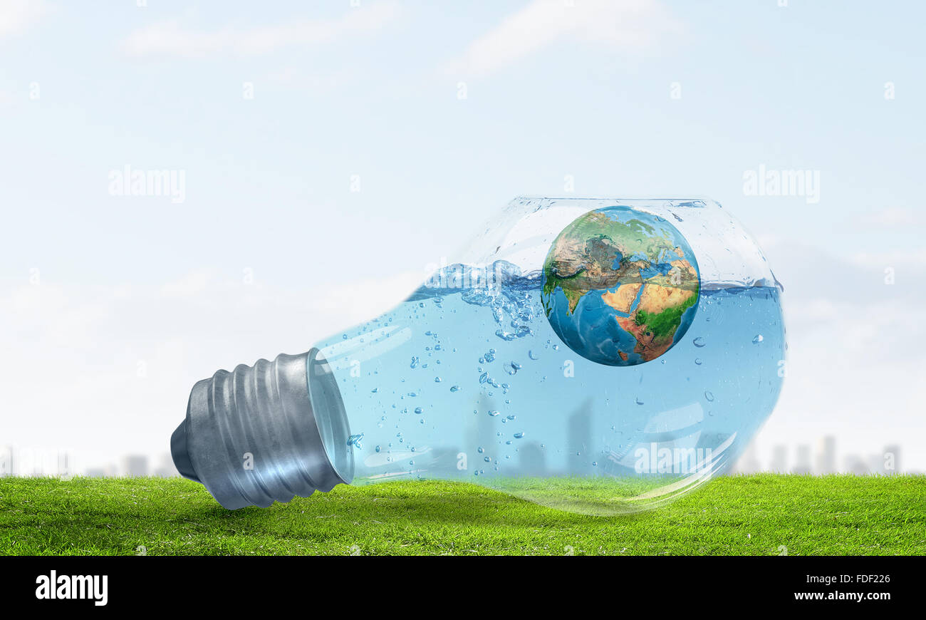 Glass light bulb filled with water and floating Earth planet. Elements ...