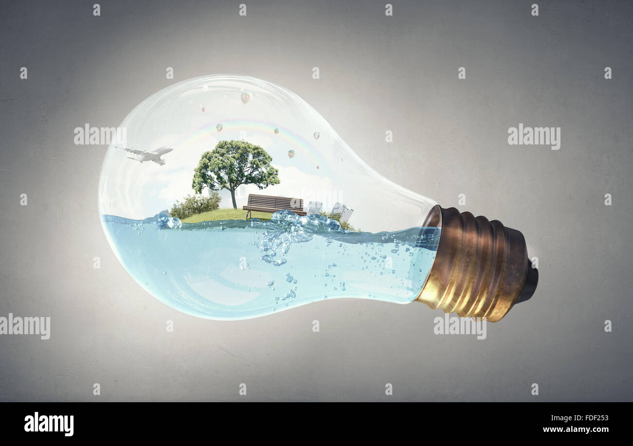 Glass light bulb with water and cityscape inside Stock Photo - Alamy