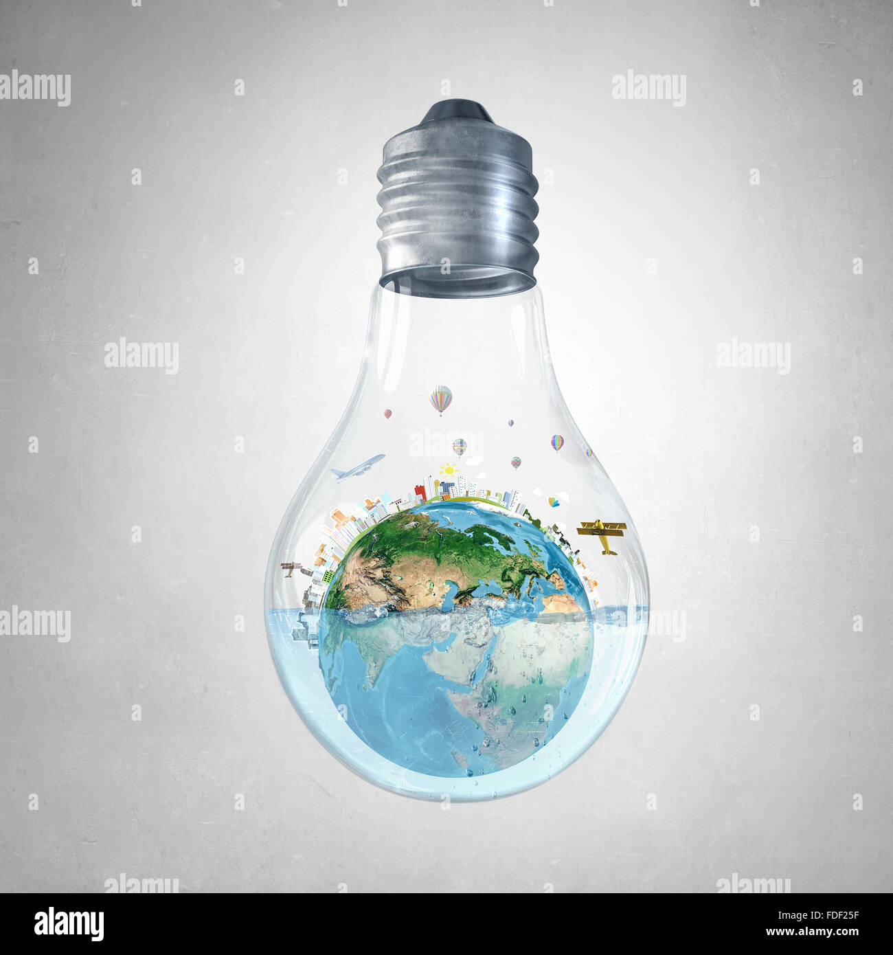 Glass light bulb filled with water and floating Earth planet. Elements ...