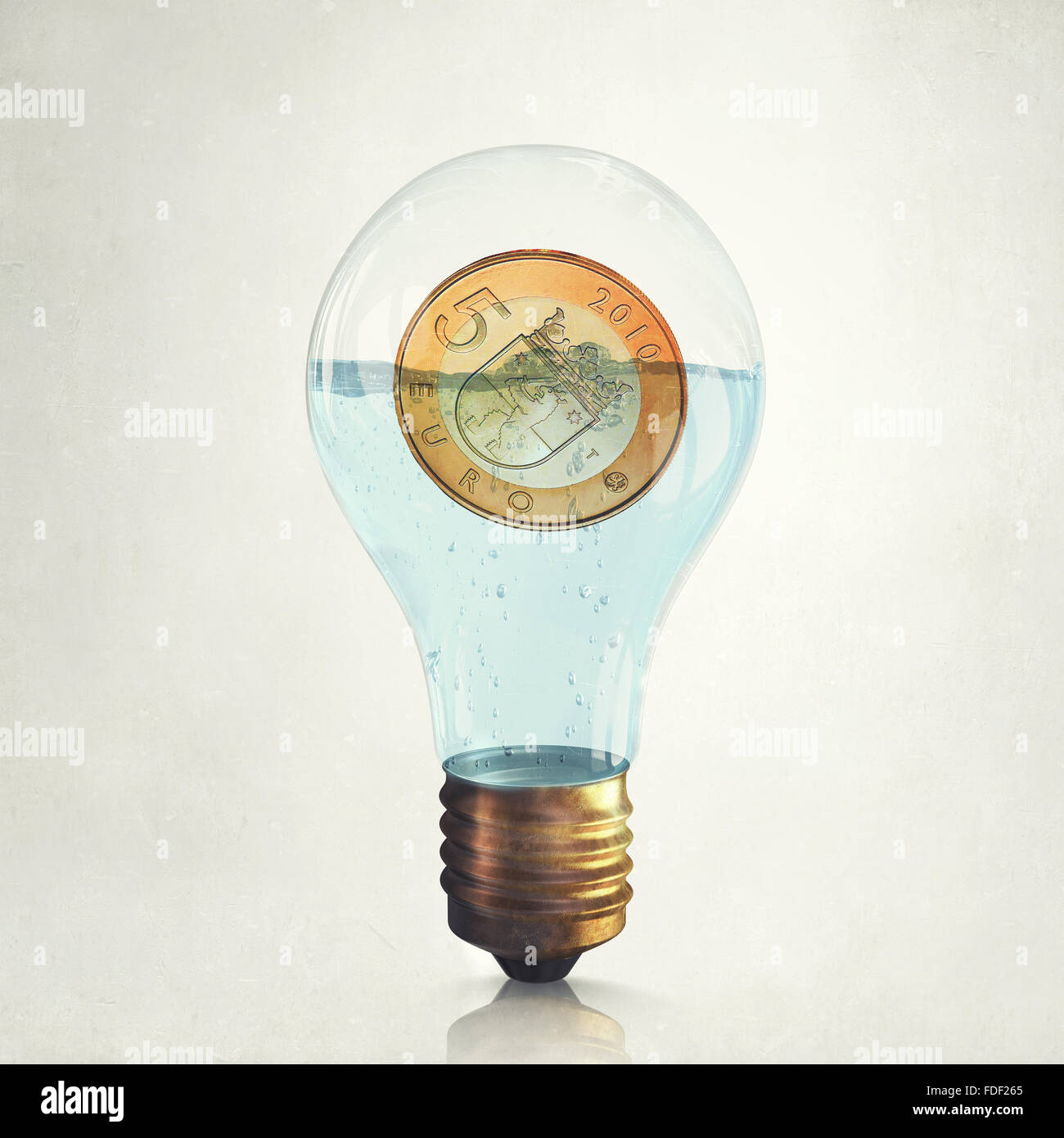 Glass light bulb with euro coin floating inside Stock Photo - Alamy