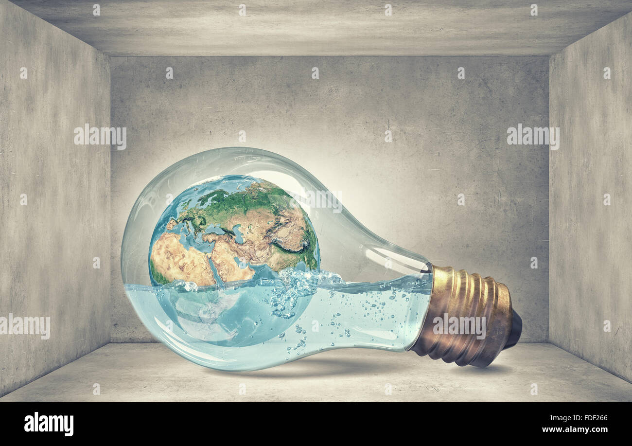 Glass light bulb filled with water and floating Earth planet. Elements ...