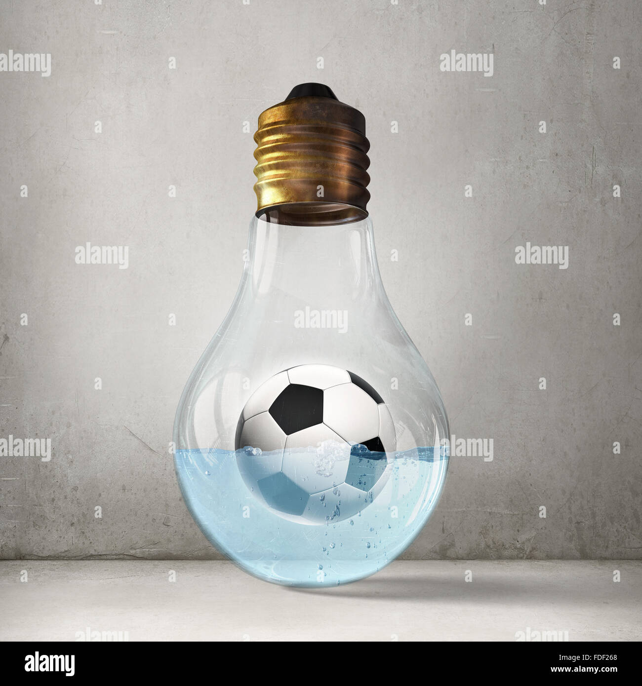 Glass lightbulb with football inside floating in water Stock Photo - Alamy