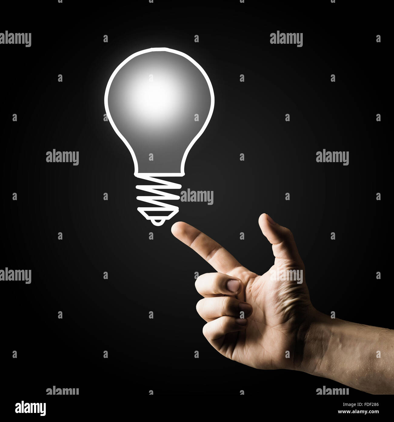 Human hand pointing with finger at light bulb Stock Photo - Alamy