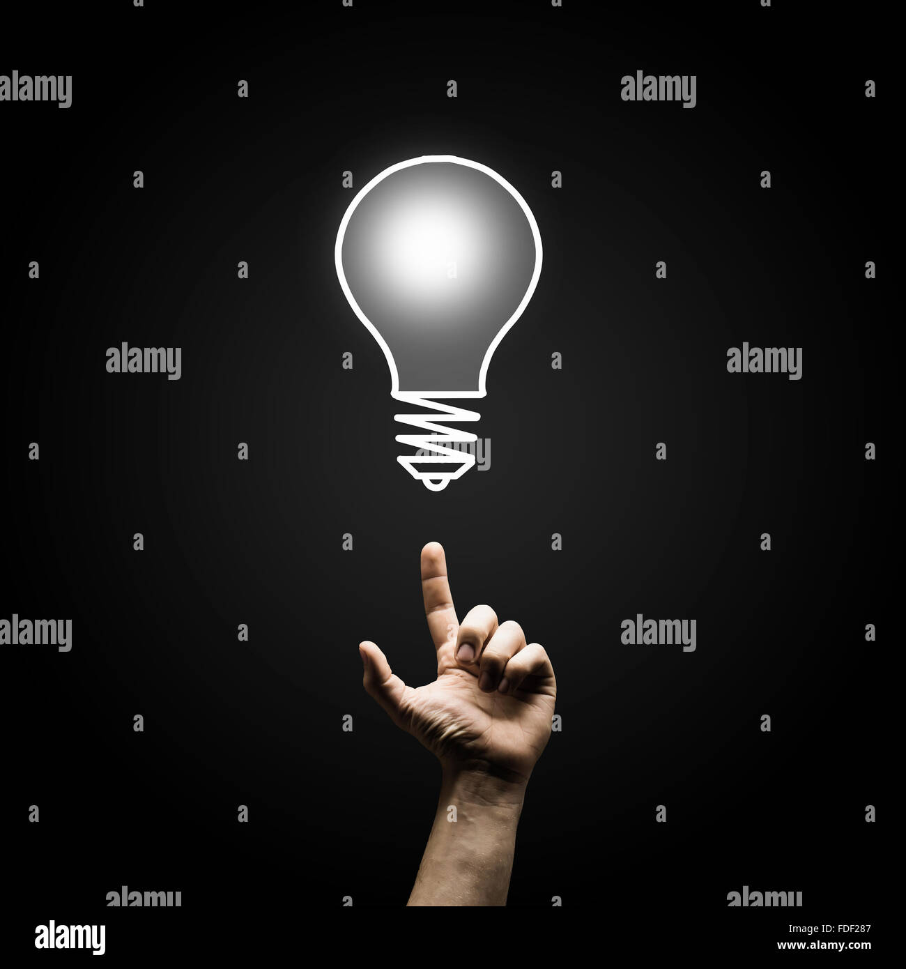 Human hand pointing with finger at light bulb Stock Photo - Alamy