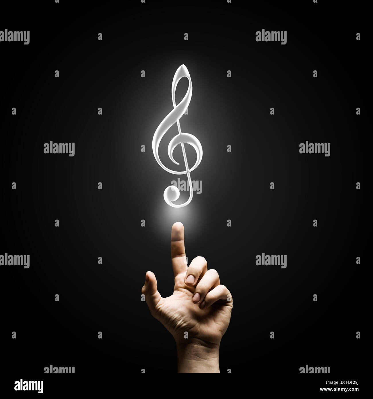 Male hand pointing with finger at music sign Stock Photo - Alamy