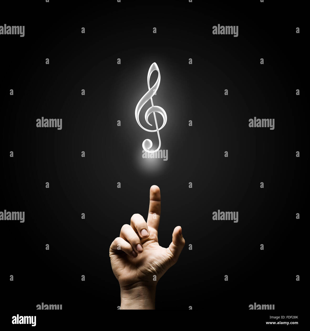 Male hand pointing with finger at music sign Stock Photo - Alamy