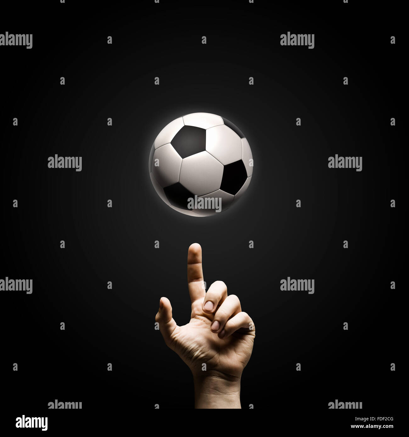 Close up of man hand pointing at soccer ball Stock Photo - Alamy