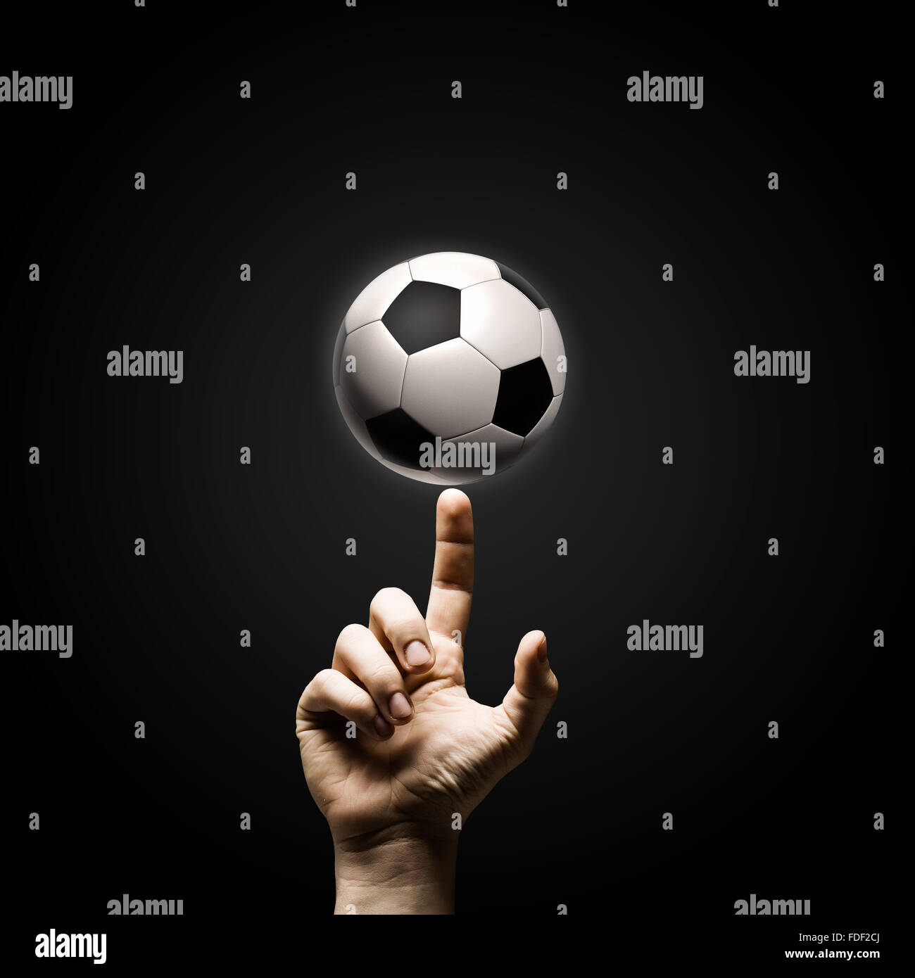 Close up of man hand pointing at soccer ball Stock Photo - Alamy