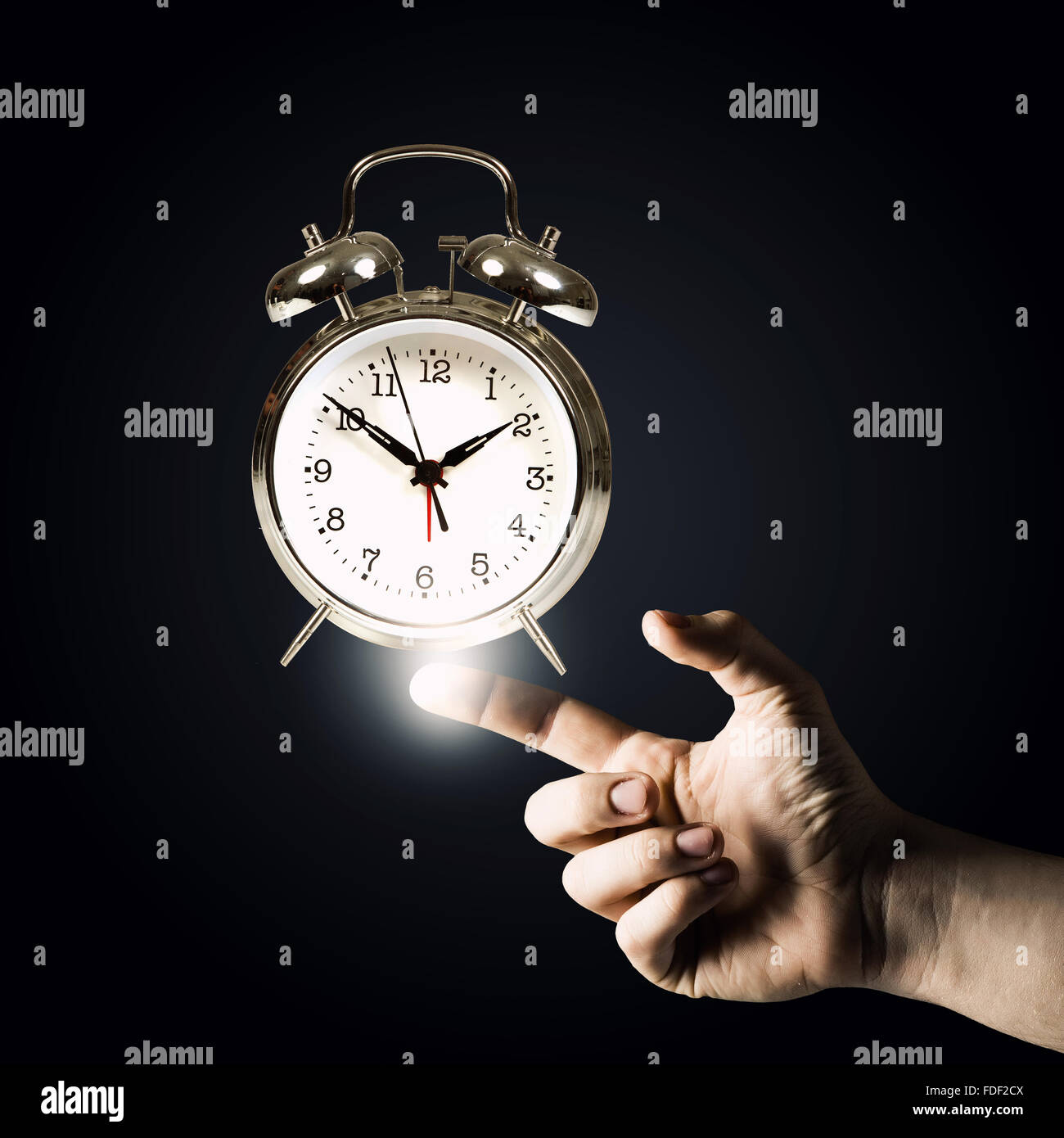 Close up of man hand pointing at clock watch Stock Photo - Alamy