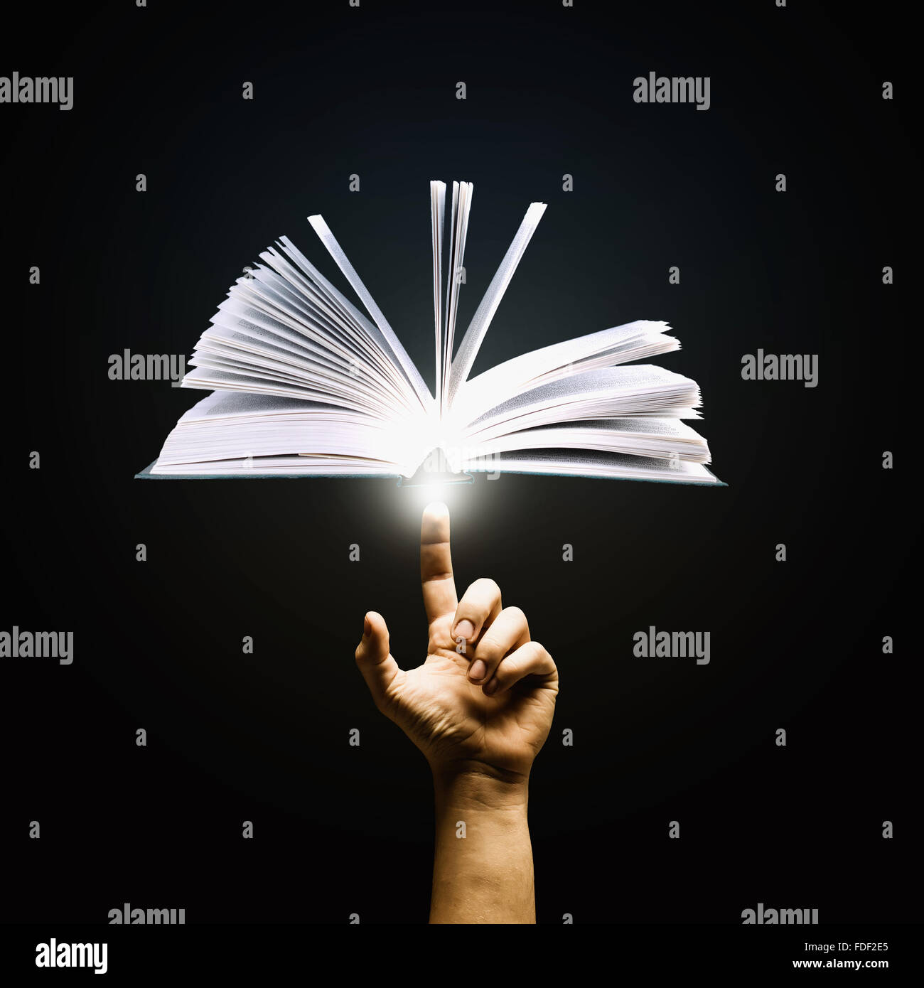 Close up of man hand pointing with finger at book Stock Photo - Alamy