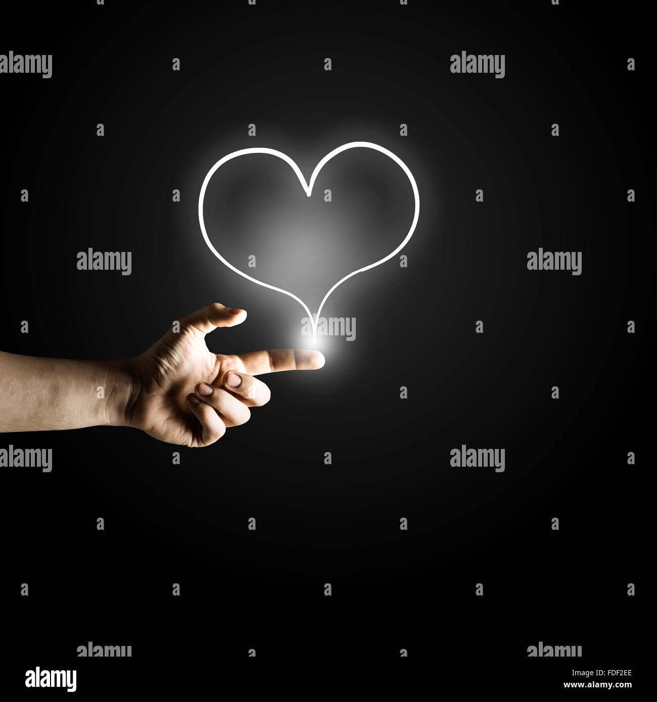 Man's hand pressing heart icon button on digital touch screen Stock ...