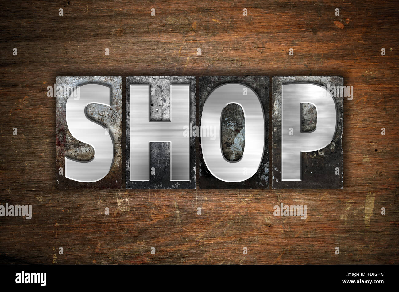 The word "Shop" written in vintage metal letterpress type on an aged ...