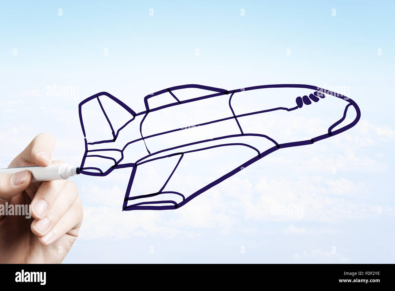 Person drawing airplane model on sky background Stock Photo - Alamy