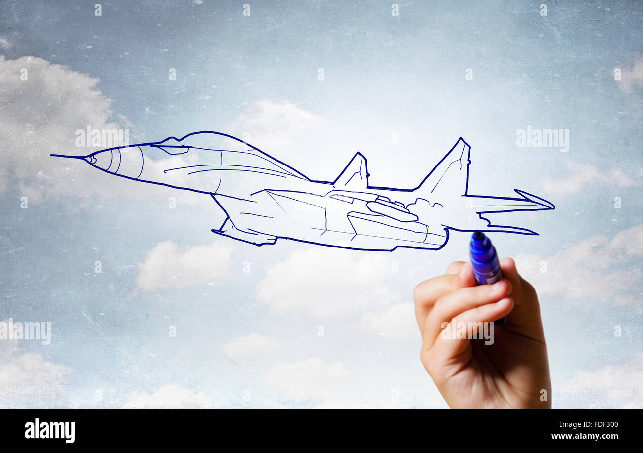 Person drawing airplane model on sky background Stock Photo - Alamy
