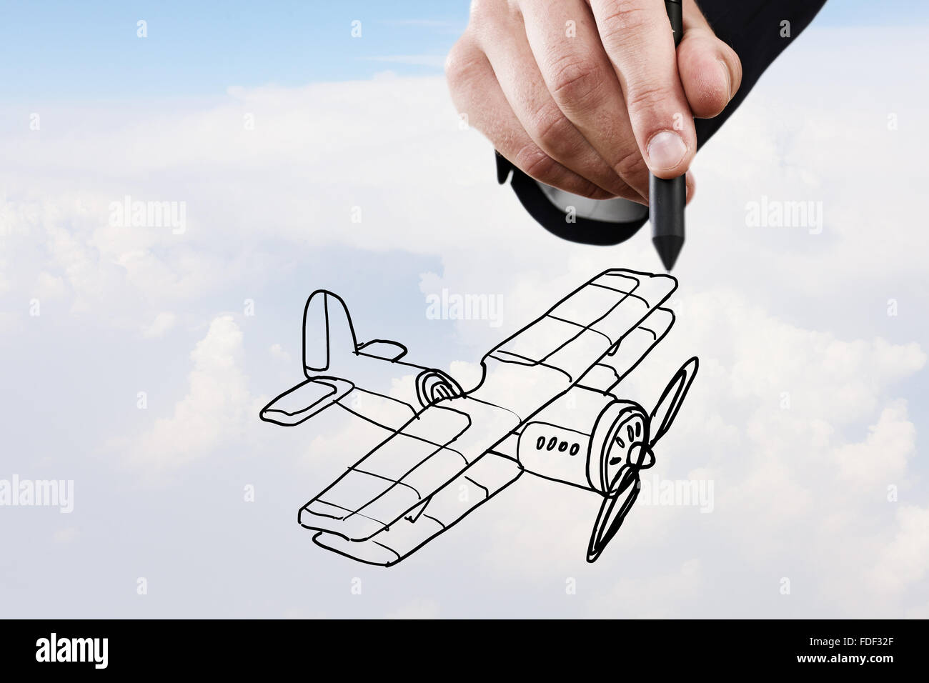 Person hand drawing old airplane on sky background Stock Photo - Alamy