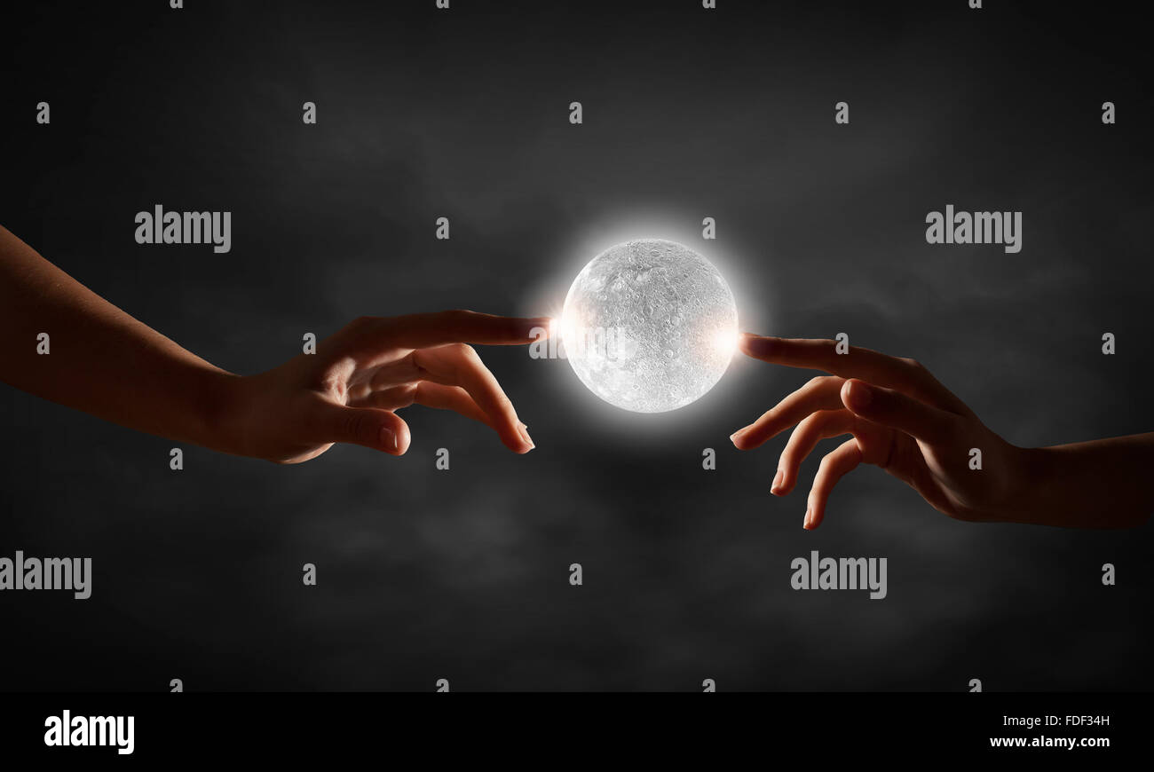 Close up of human hands touching with fingers and moon planet Stock ...