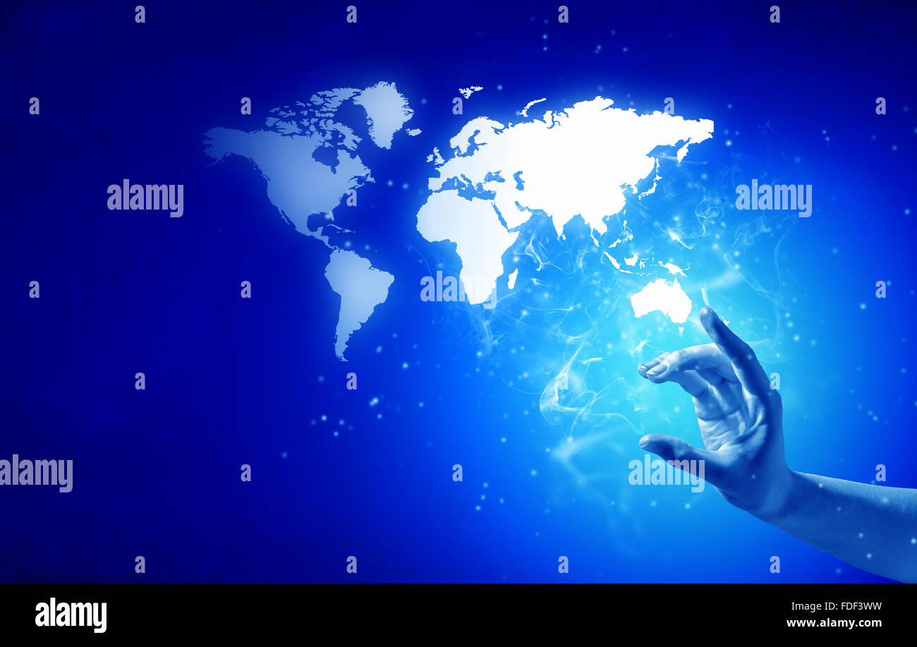 Person hand taking world map on blue background Stock Photo - Alamy