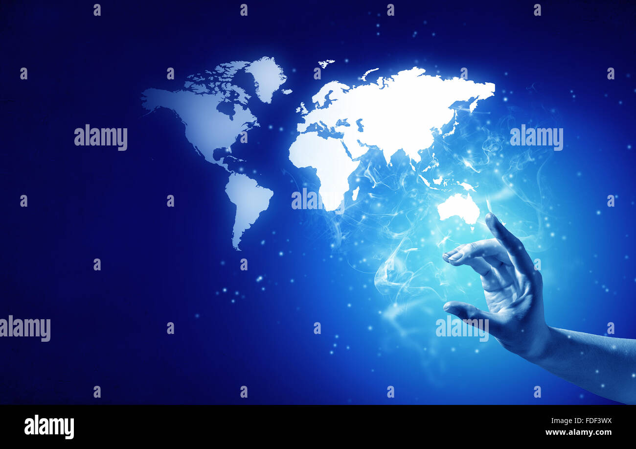 Person hand taking world map on blue background Stock Photo - Alamy