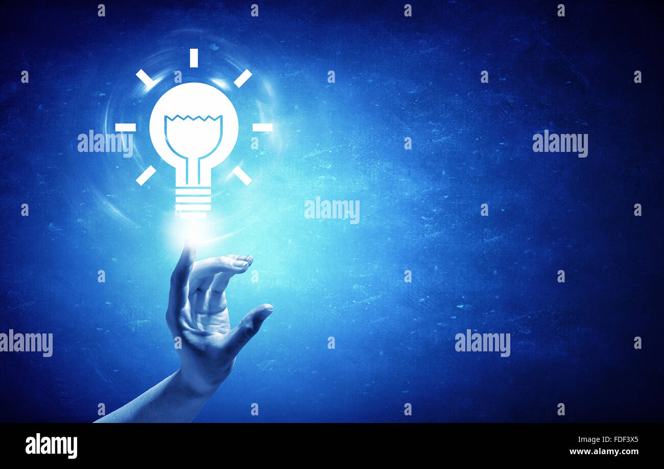 Close up of human hand touching with finger light bulb Stock Photo - Alamy