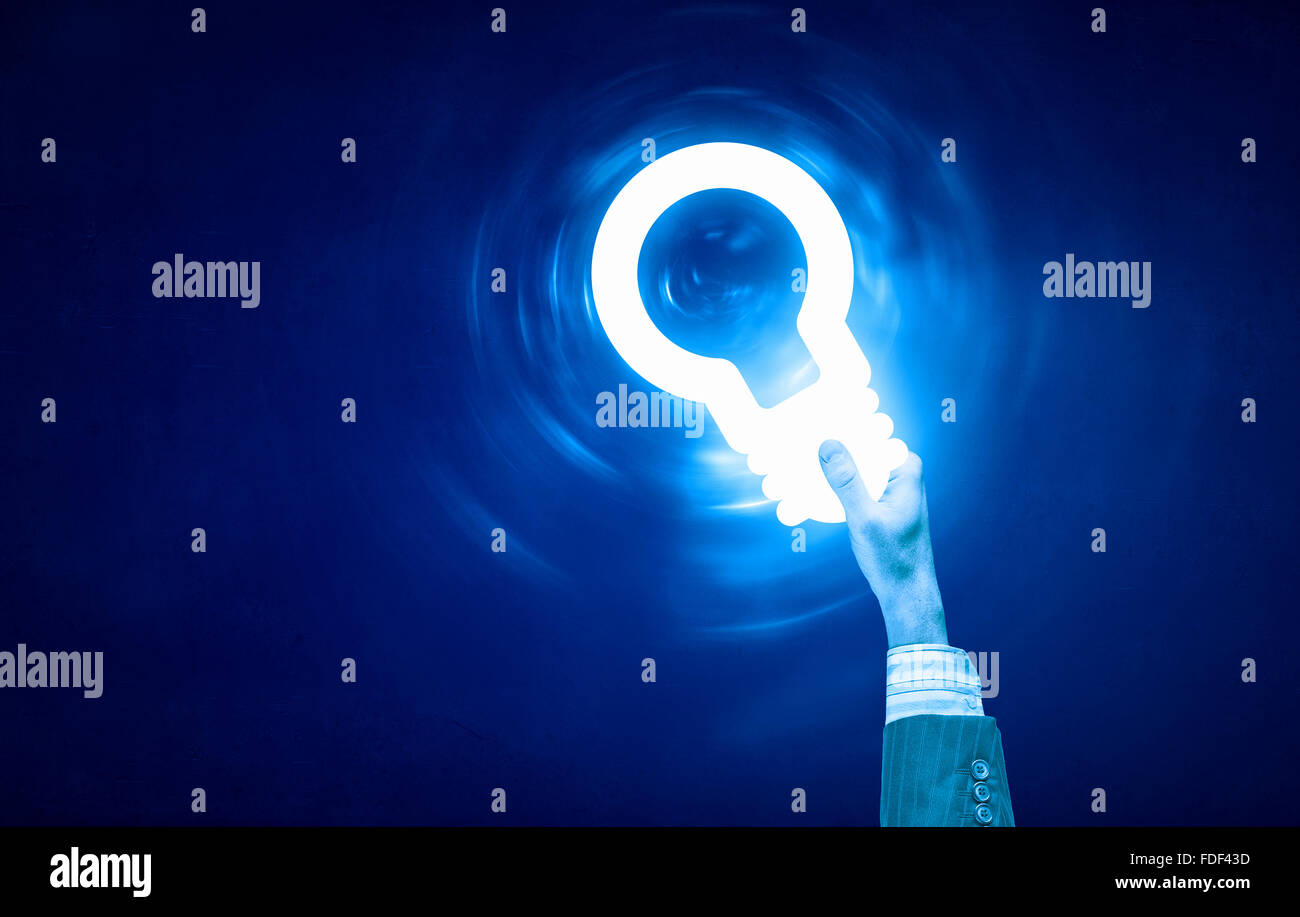 Close up of human hand holding light bulb sign in palm Stock Photo - Alamy