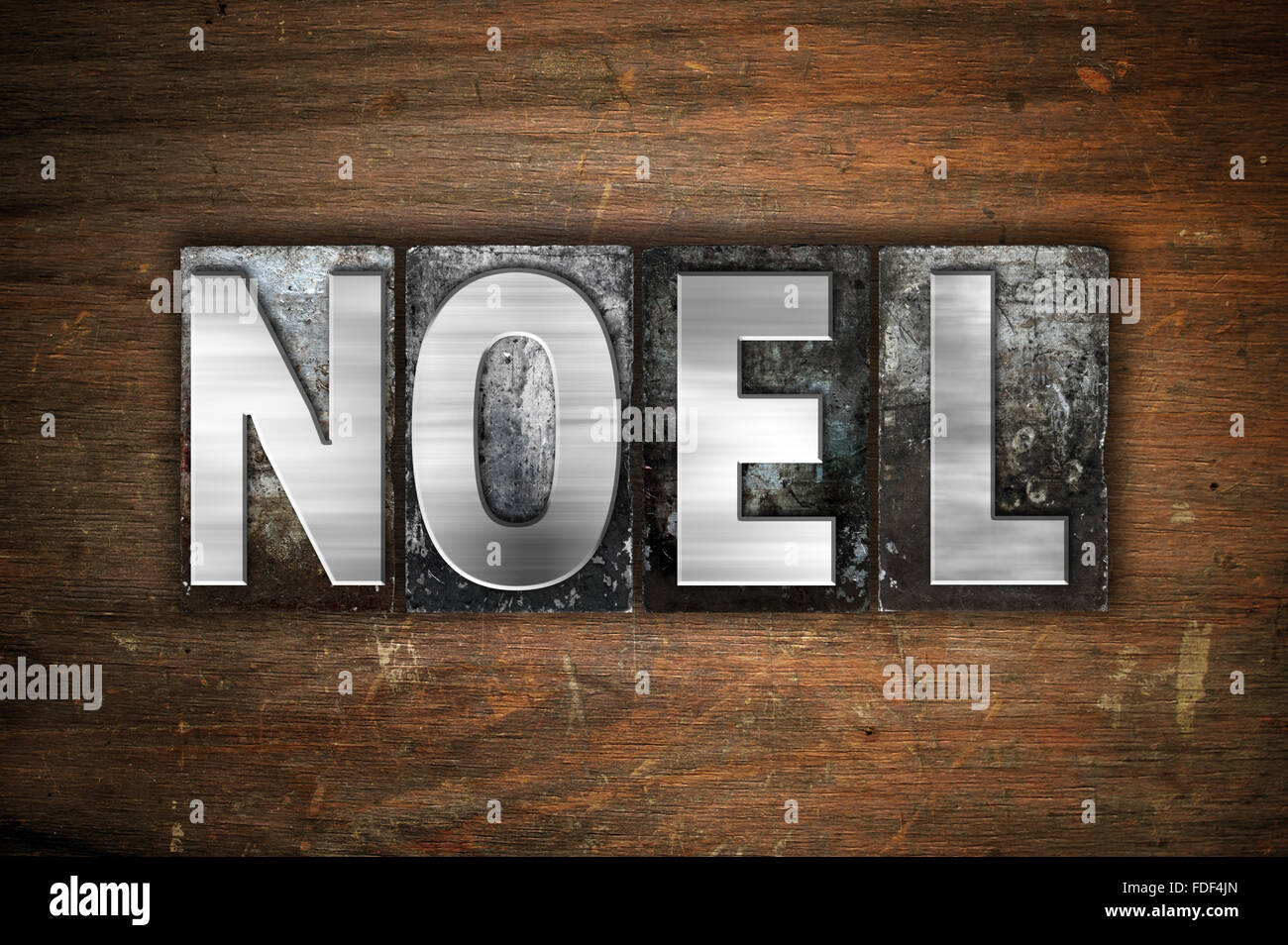 The word "Noel" written in vintage metal letterpress type on an aged ...