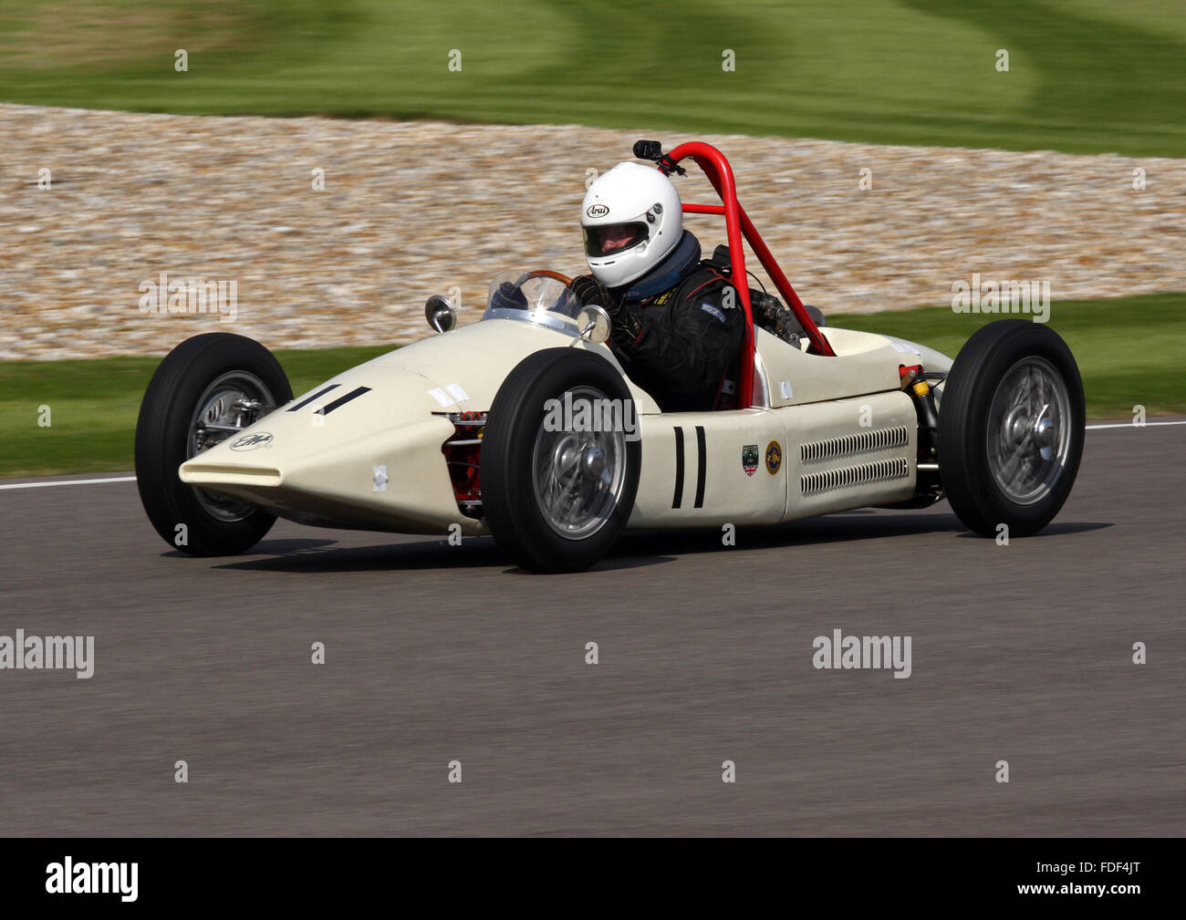 Tom Baily racing a Cooper-Maserati T51at Goodwood Revival race meeting ...