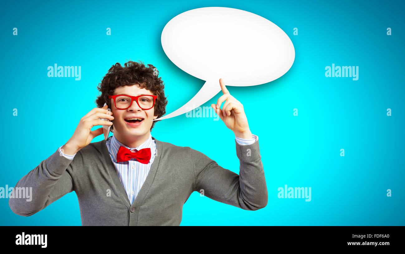 Young man talking over his mobile phone and having an idea Stock Photo ...