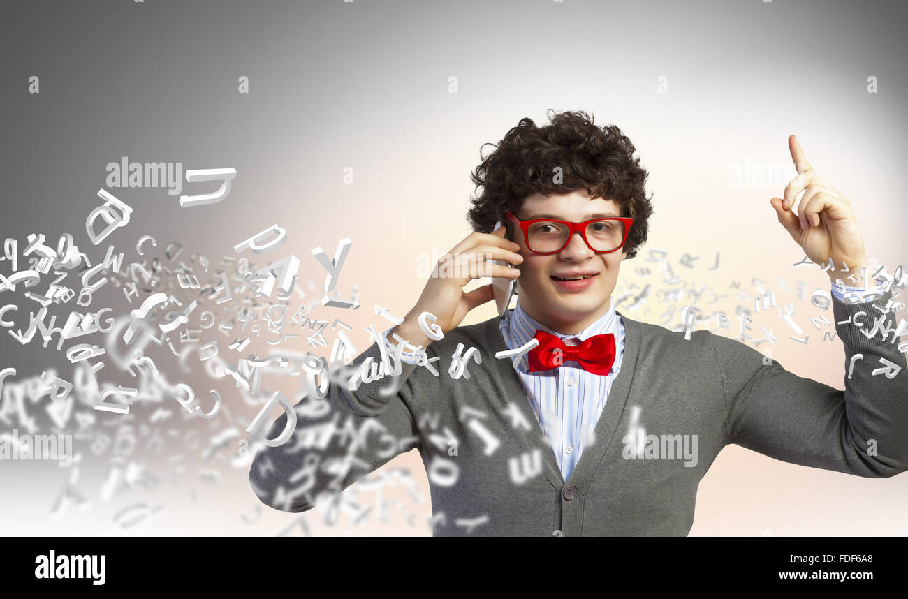 Young man talking over his mobile phone and having an idea Stock Photo ...