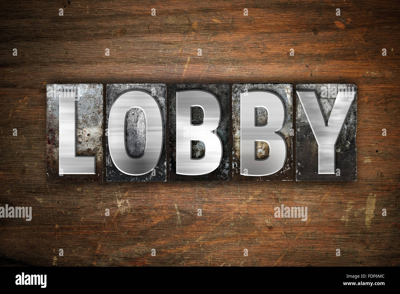 The word "Lobby" written in vintage metal letterpress type on an aged ...