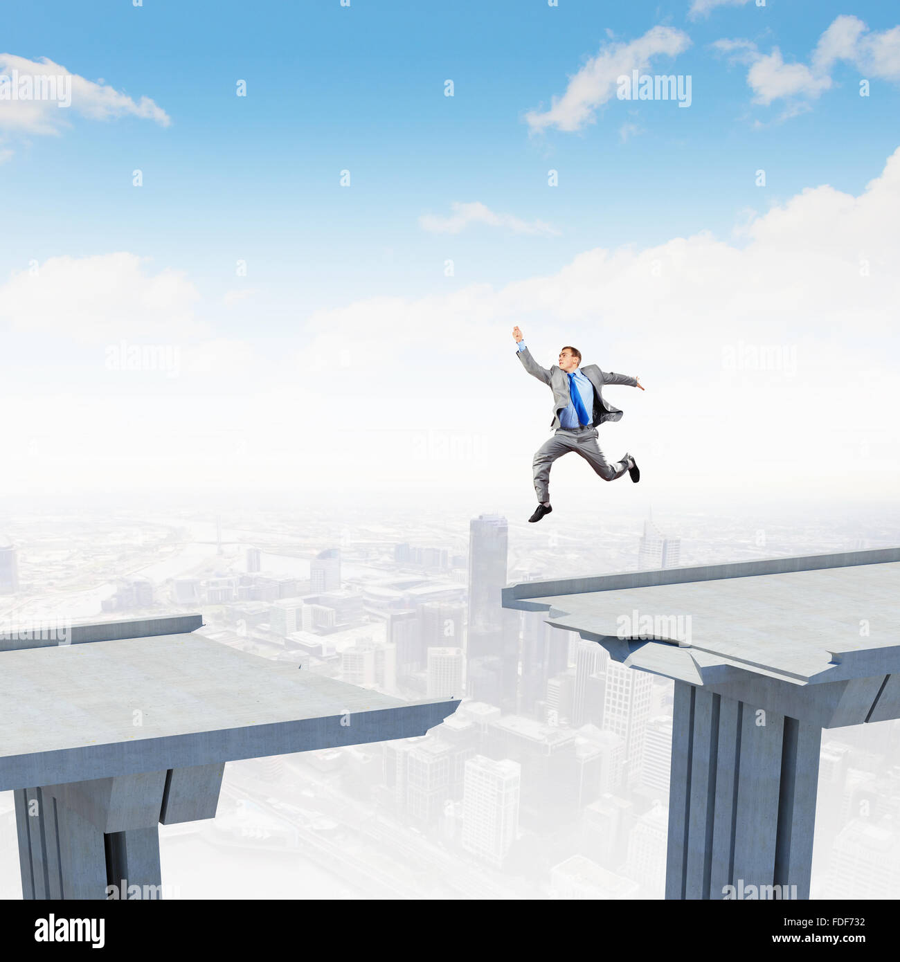 Businessman jumping over a gap in the bridge as a symbol of bridge ...