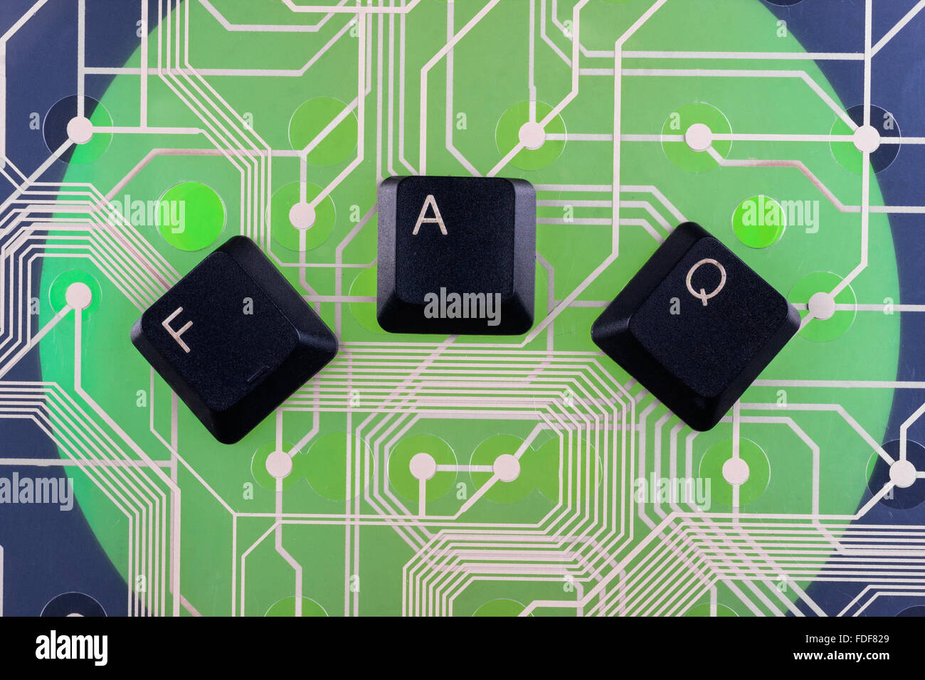 Keyboard keys laid out the word FAQ on a green background Stock Photo ...