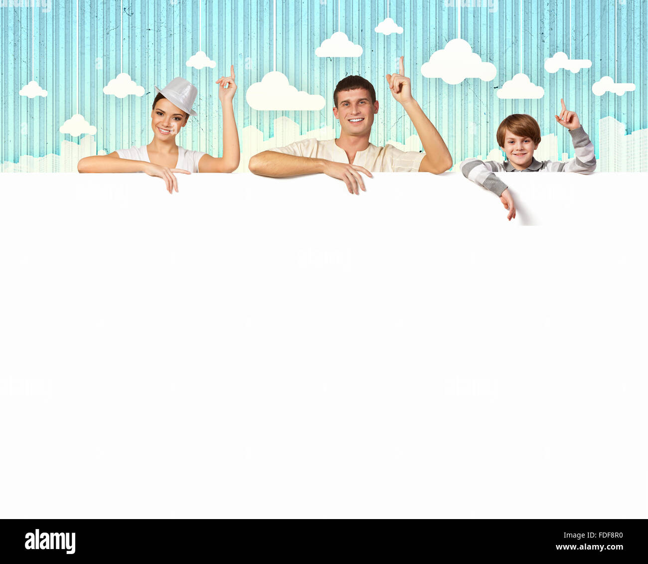 Happy young family with blank banner. Place for text Stock Photo - Alamy