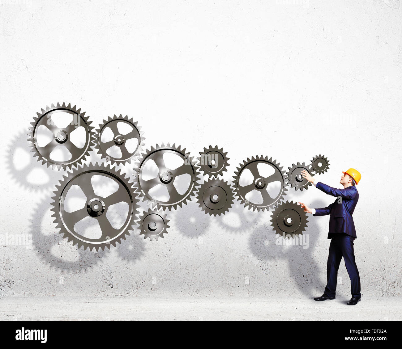 Businessman cog wheel elements construction hi-res stock photography ...