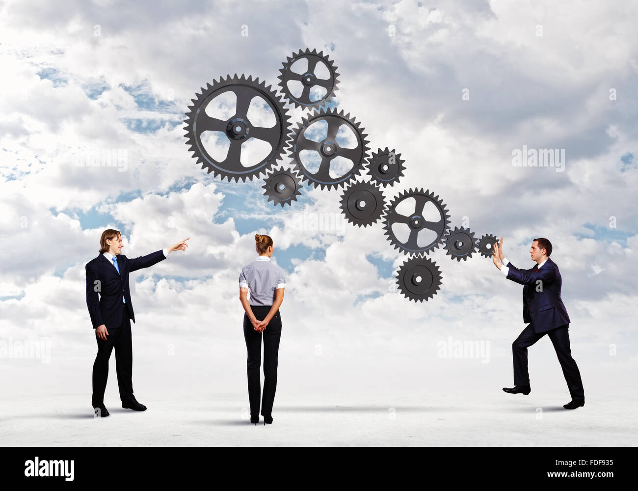 Businessman and businesswoman with cog wheel elements. Organization ...