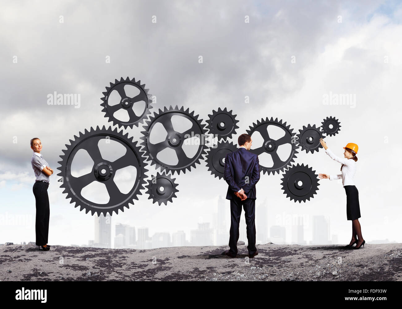 Businessman and businesswoman with cog wheel elements. Organization ...