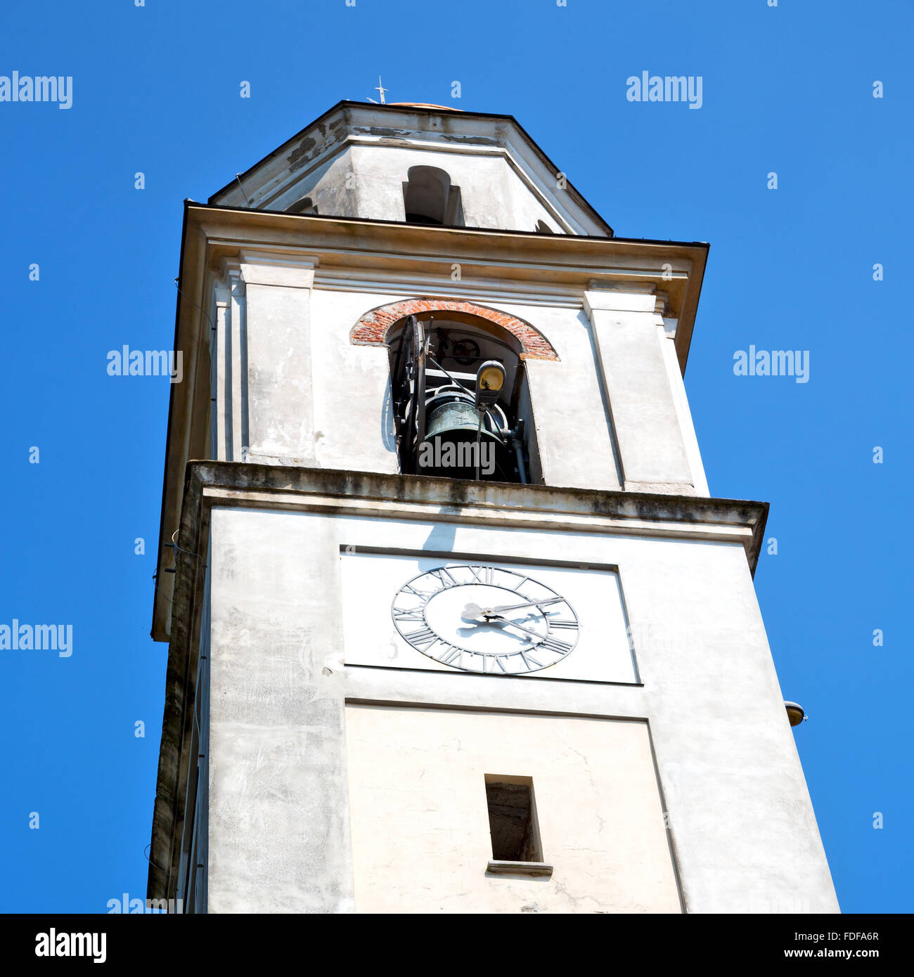 ancien clock tower in italy europe old stone and bell Stock Photo - Alamy
