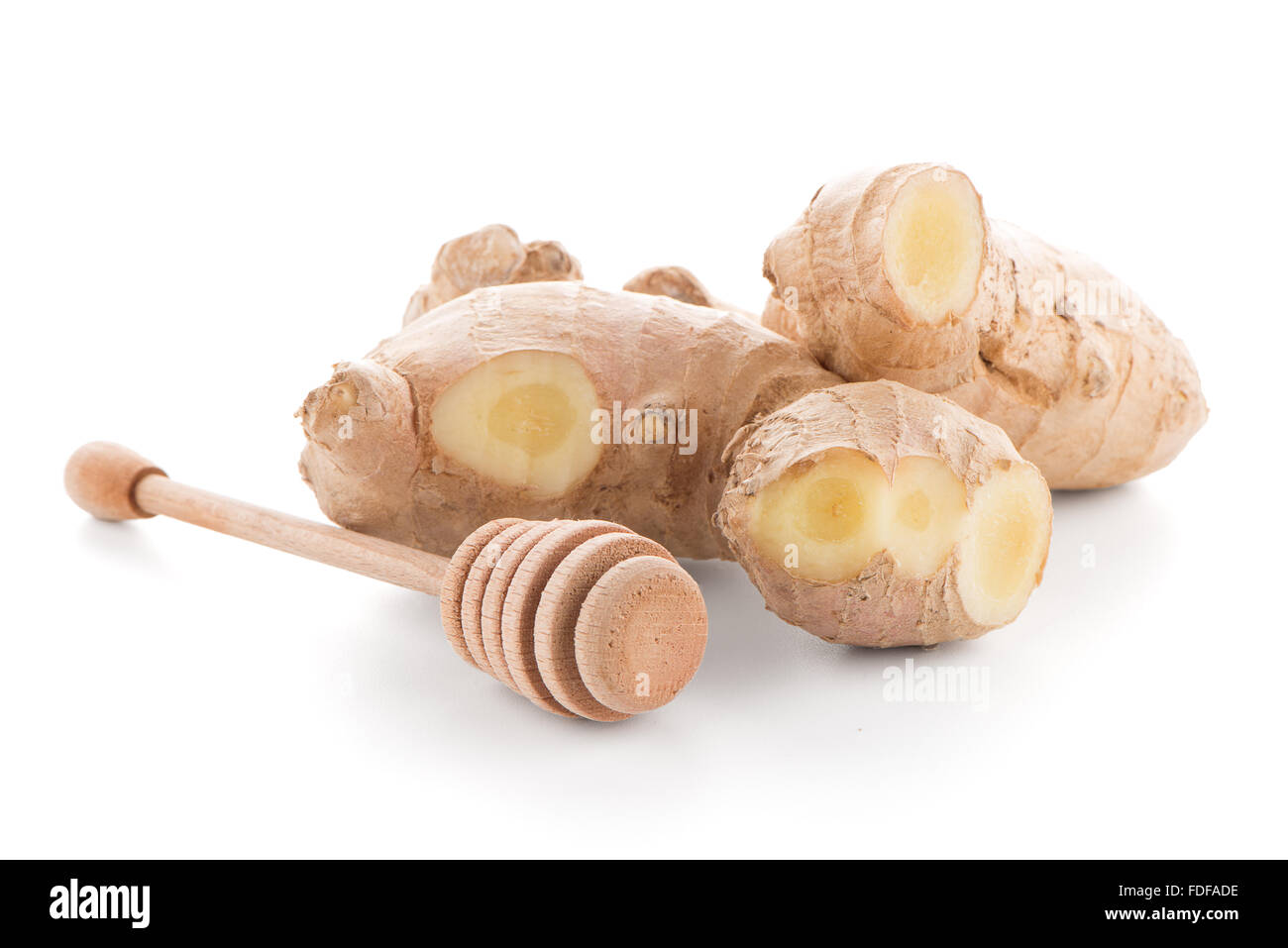 Ginger root and drizzler isolated on white background Stock Photo - Alamy