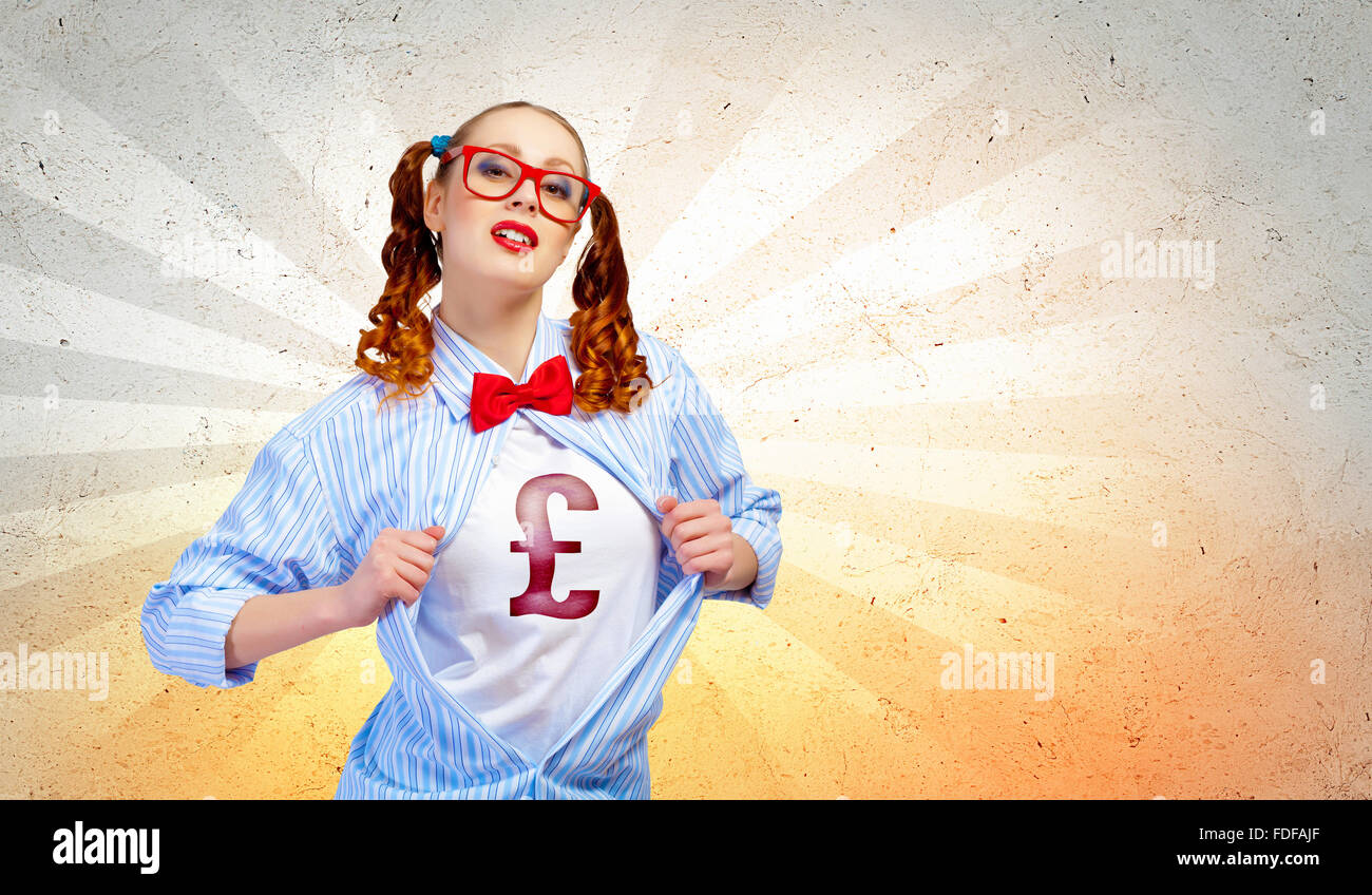 Young woman acting like super hero with pound sign on chest Stock Photo ...