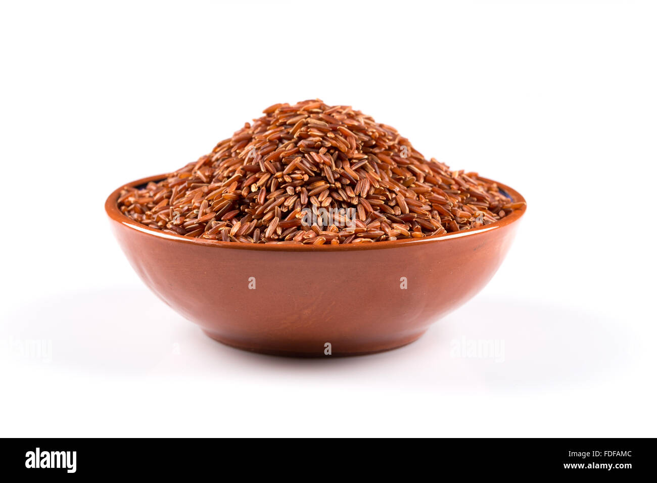 Bowl of Red Cargo Rice. Shot on white background Stock Photo - Alamy