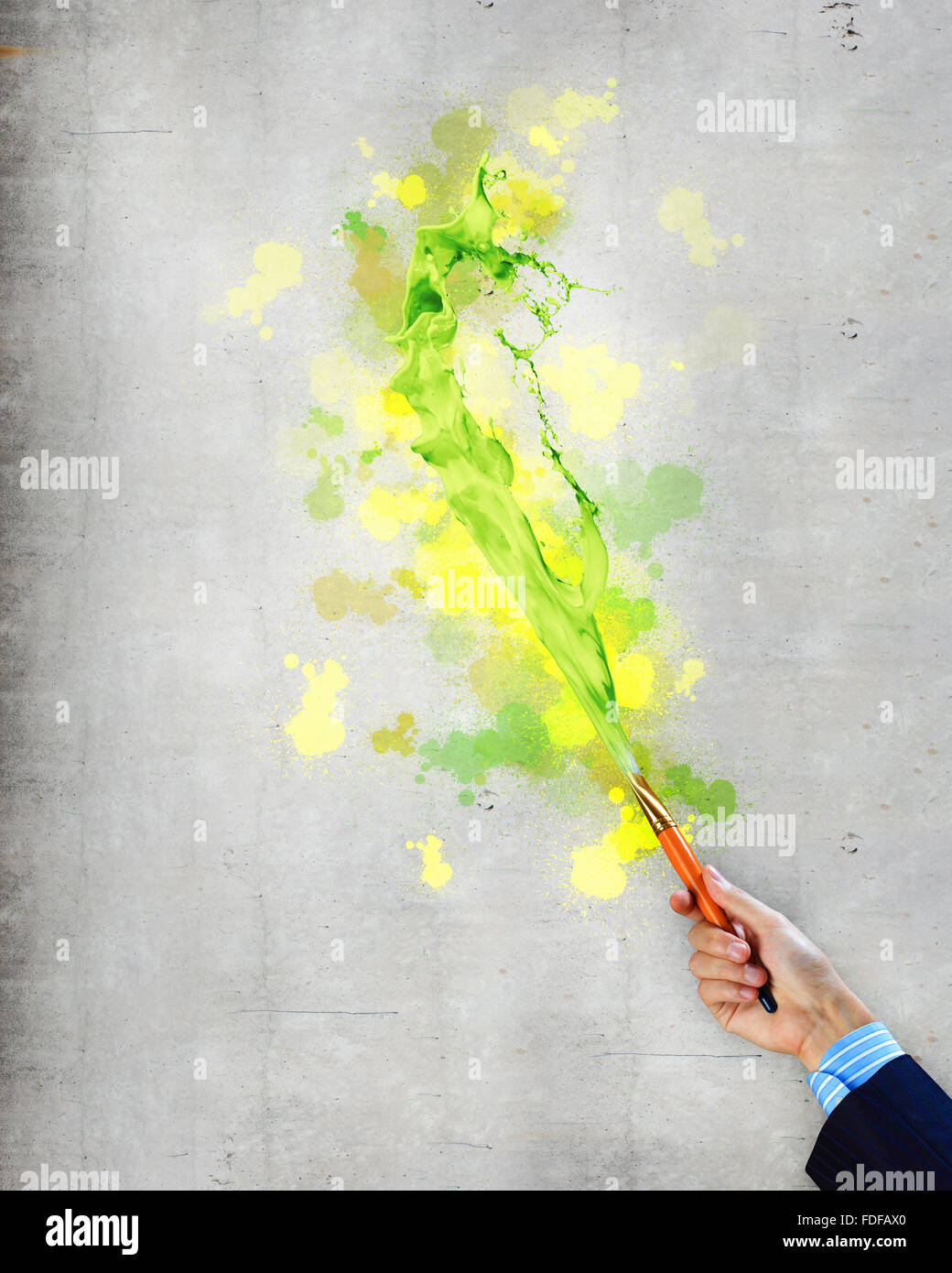 Close-up of human hand holding paint brush making colorful paint ...