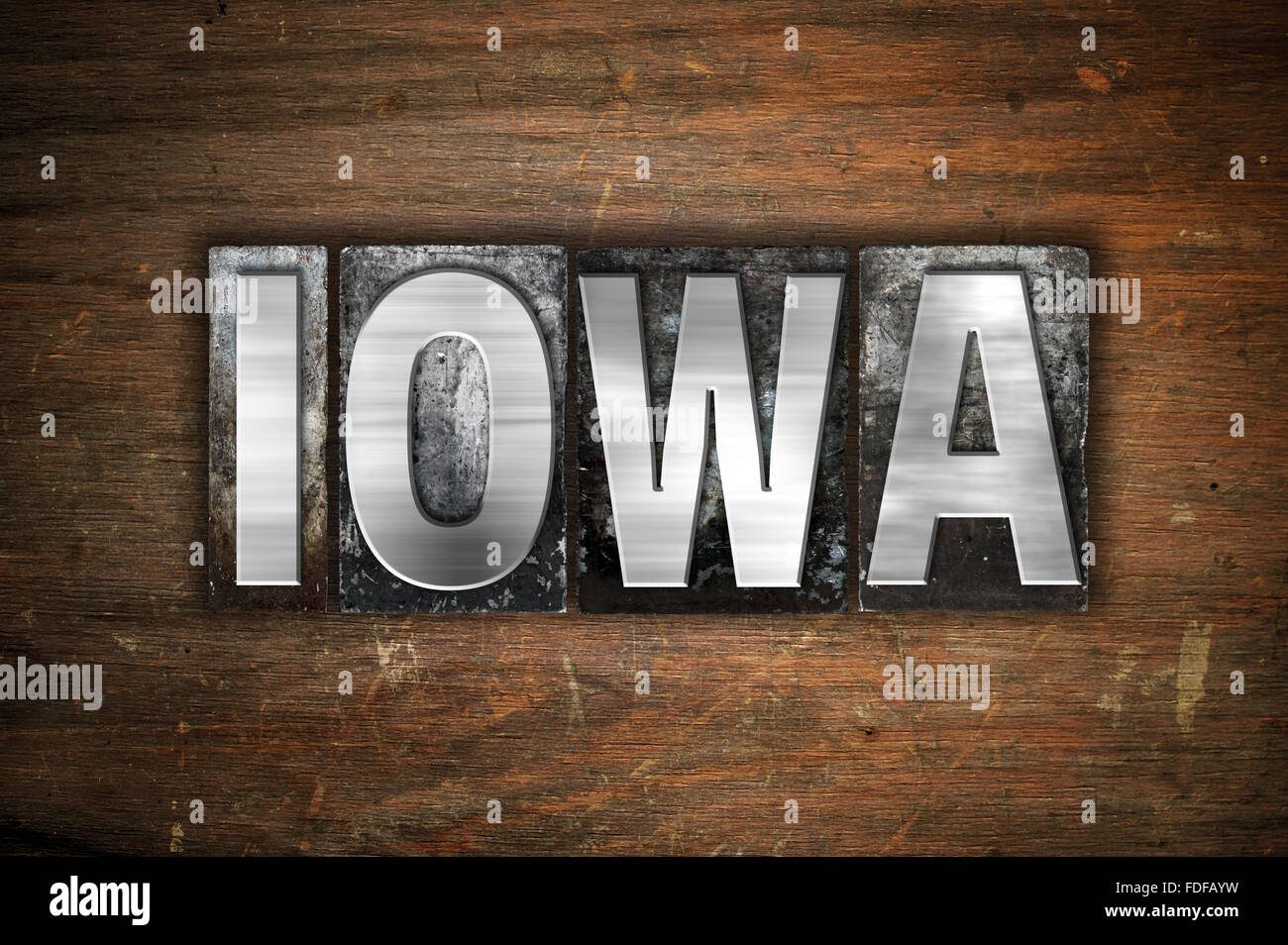 The word "Iowa" written in vintage metal letterpress type on an aged ...